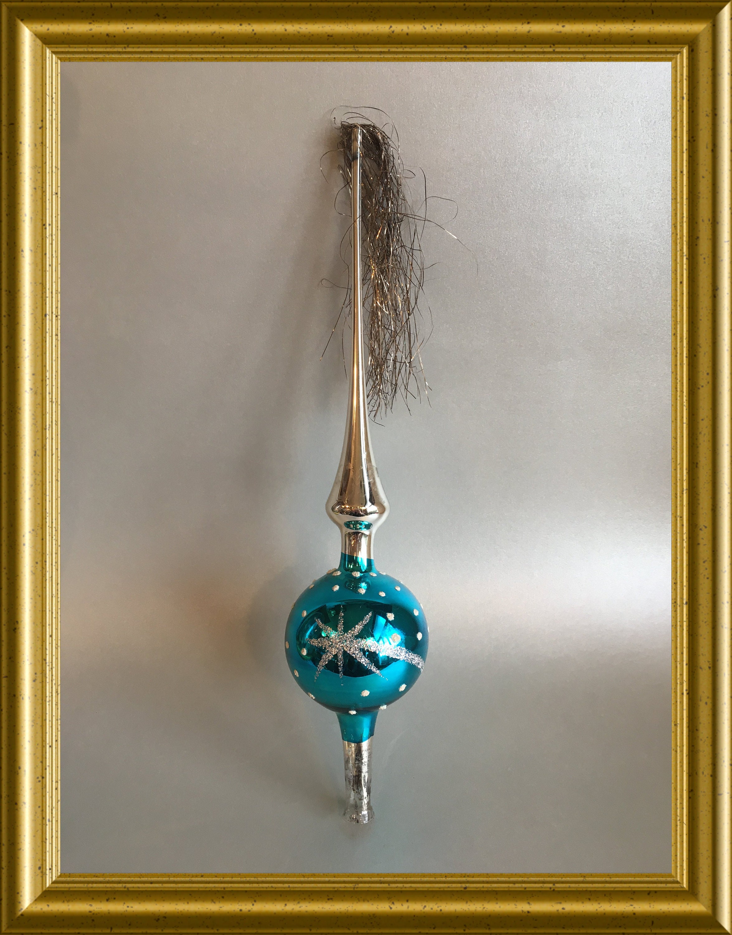 Vintage blue glass tree topper with a star, celestial tree topper