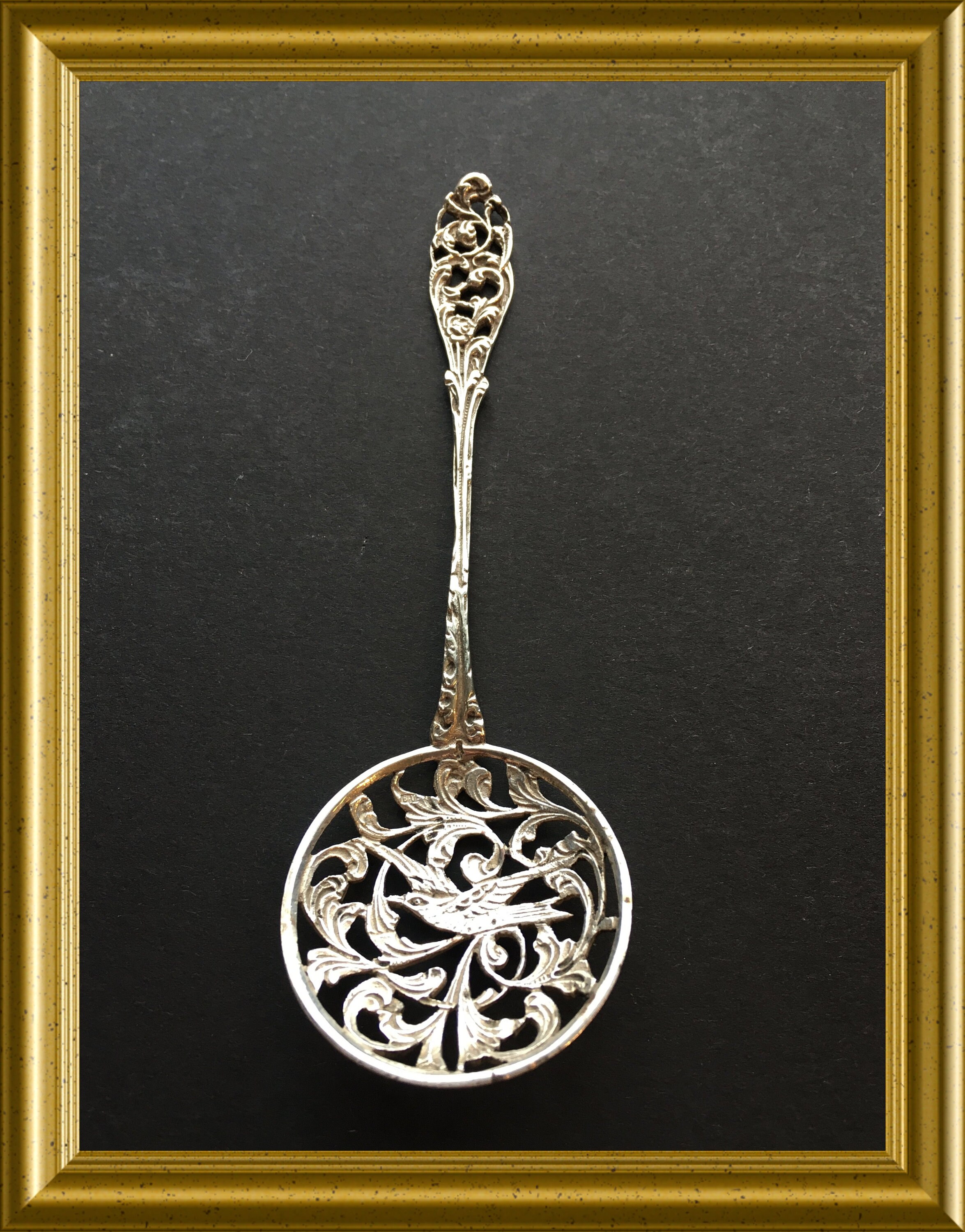Antique small ornate pierced silver serving spoon: bird