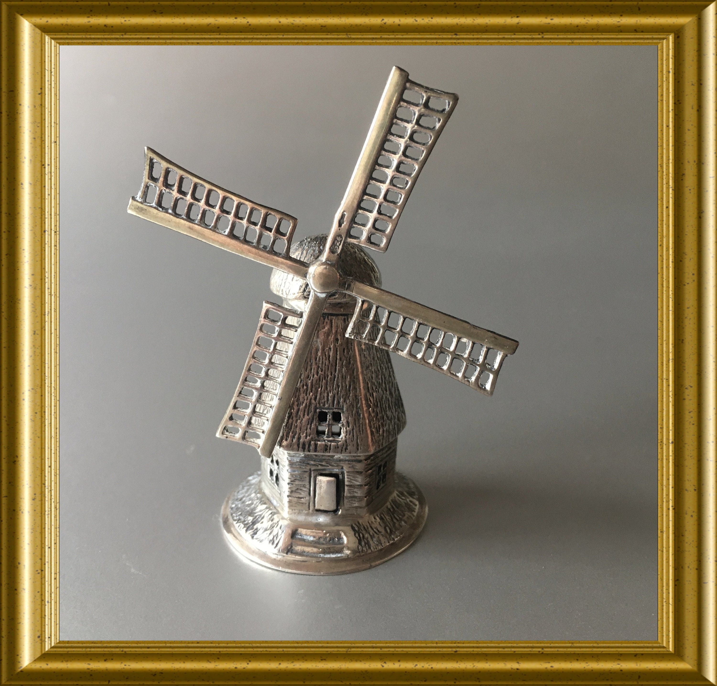 Miniature silver windmill with turnable blades, large model