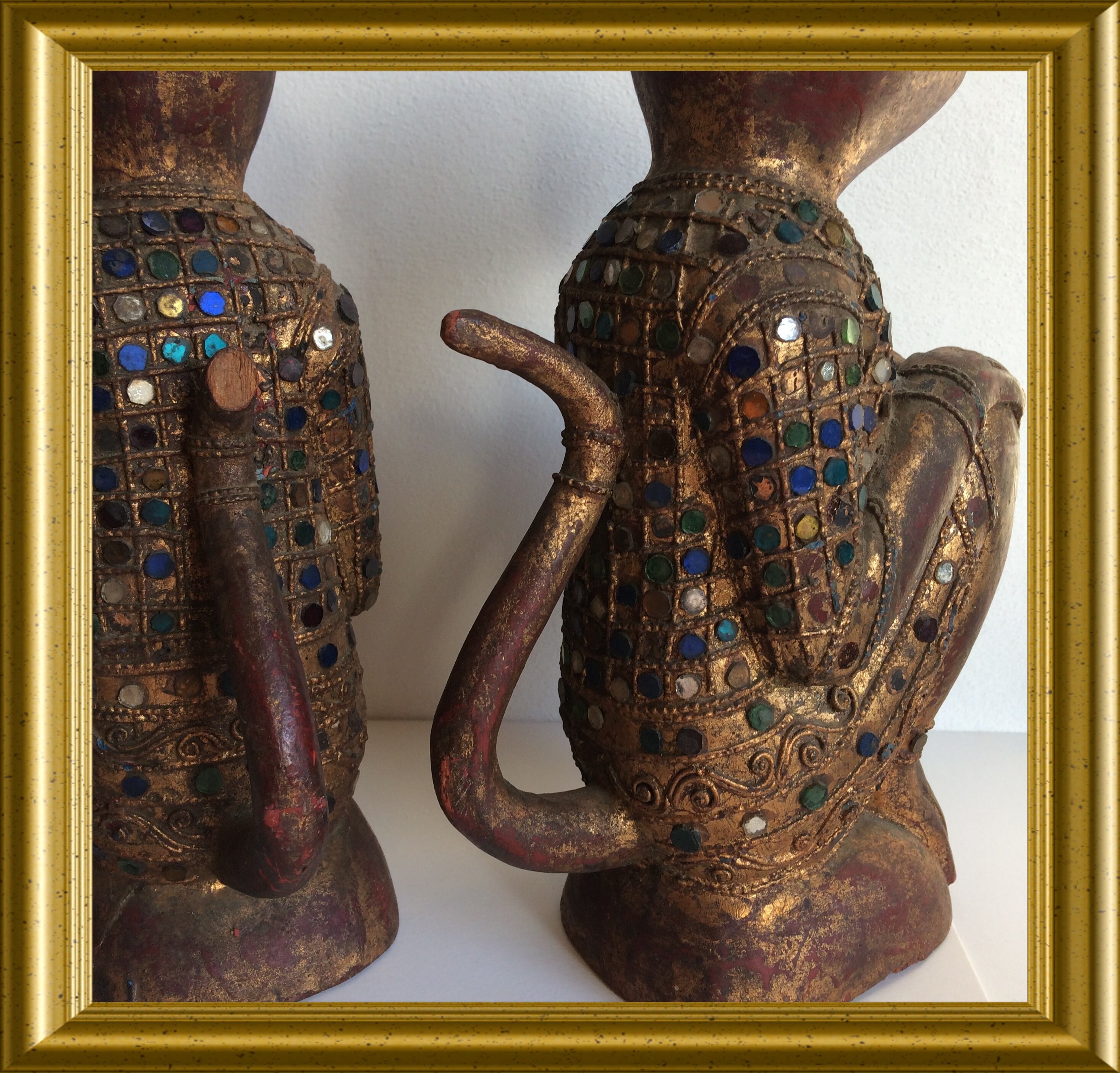 Two vintage wood carved monkeys, decorated with pieces of glass