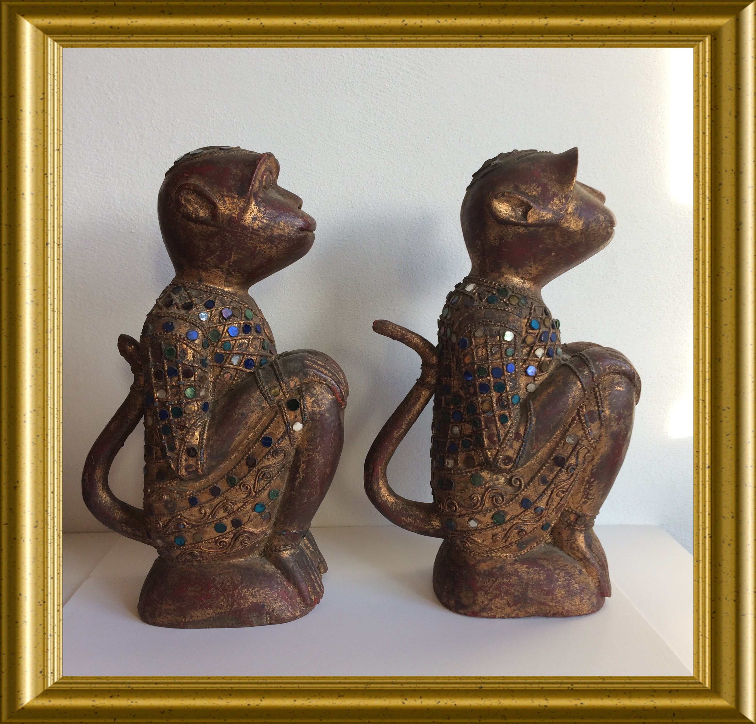Two vintage wood carved monkeys, decorated with pieces of glass