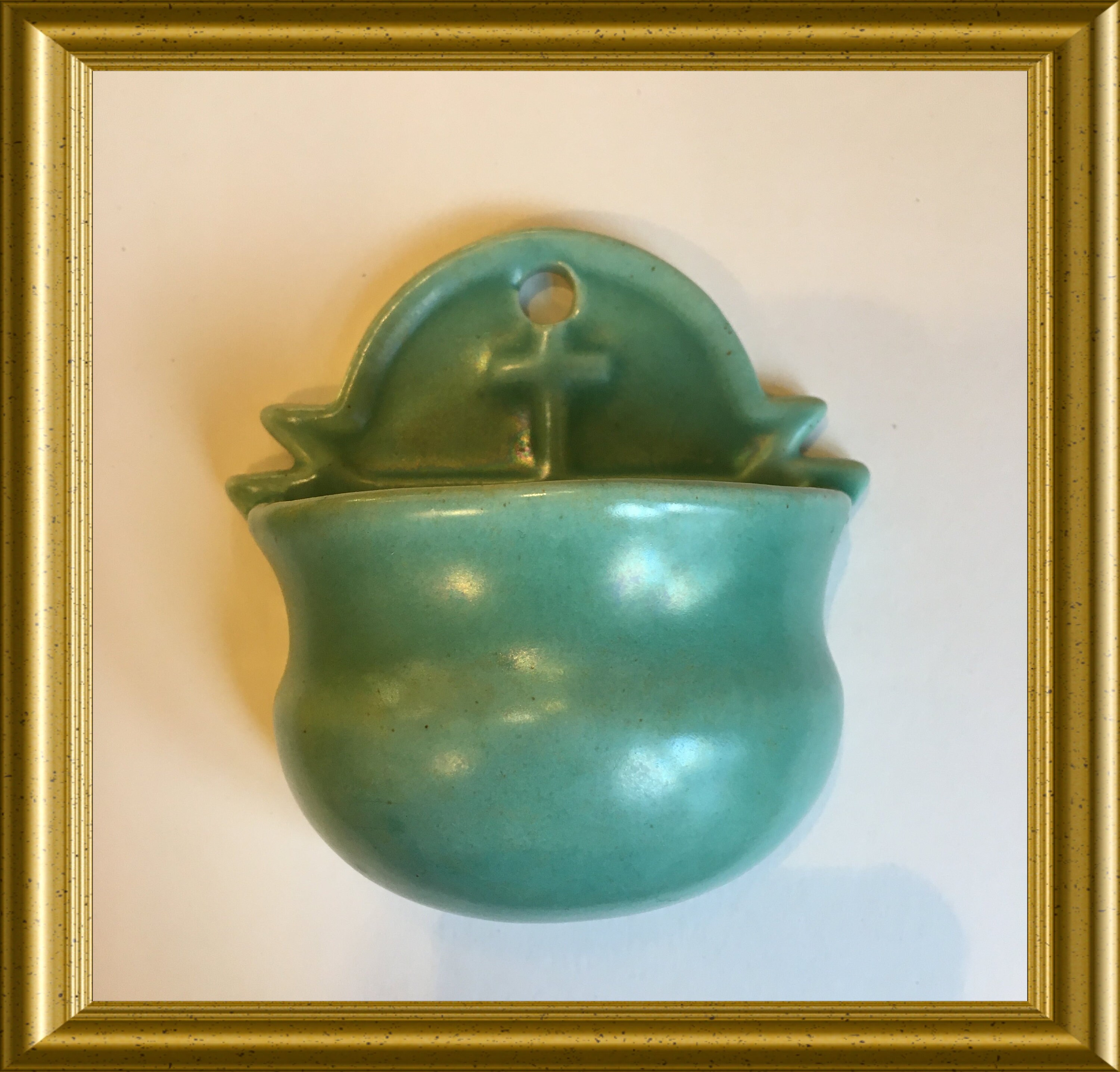Vintage green ceramic holy water font: cross