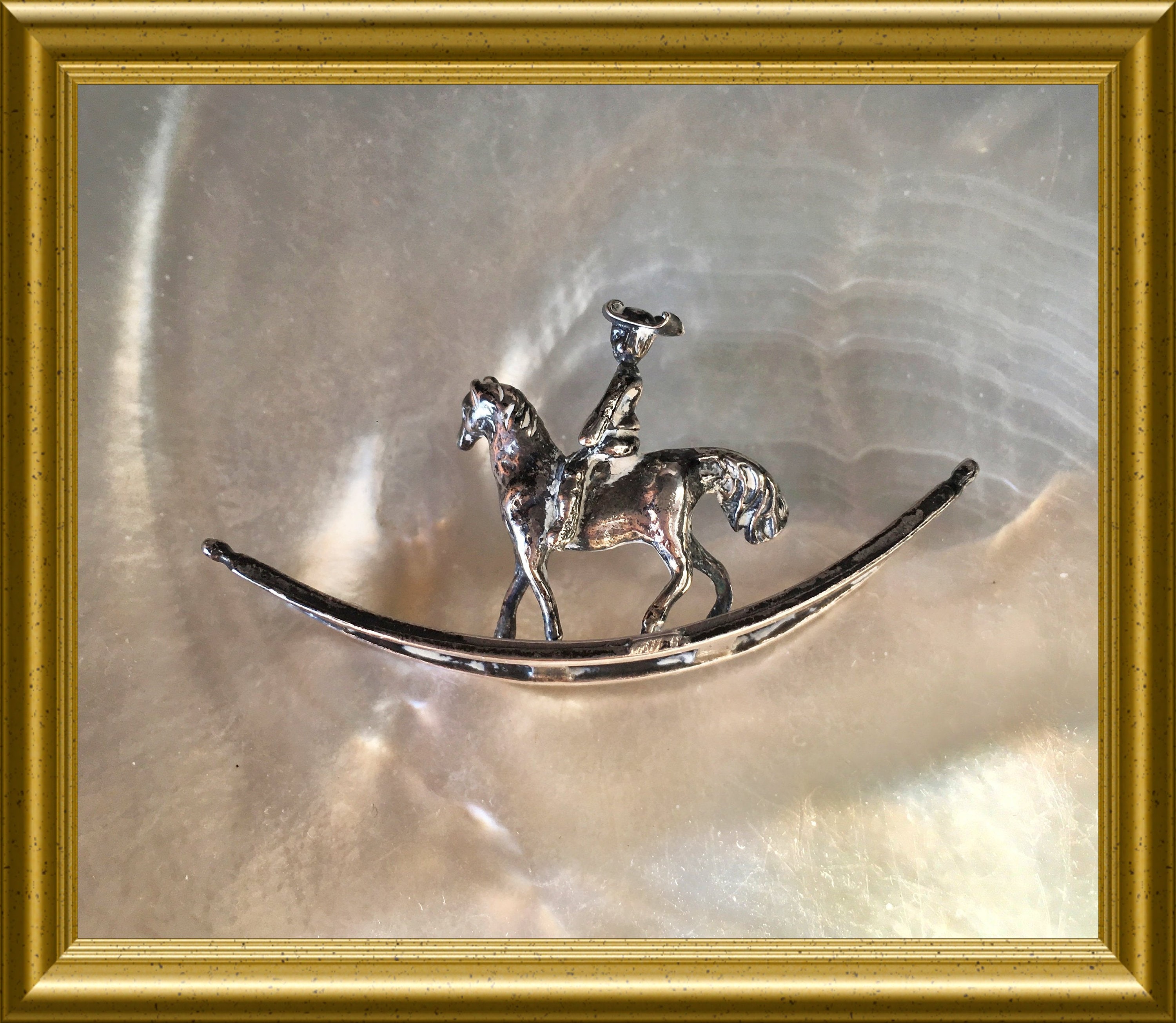 Miniature silver rocking horse