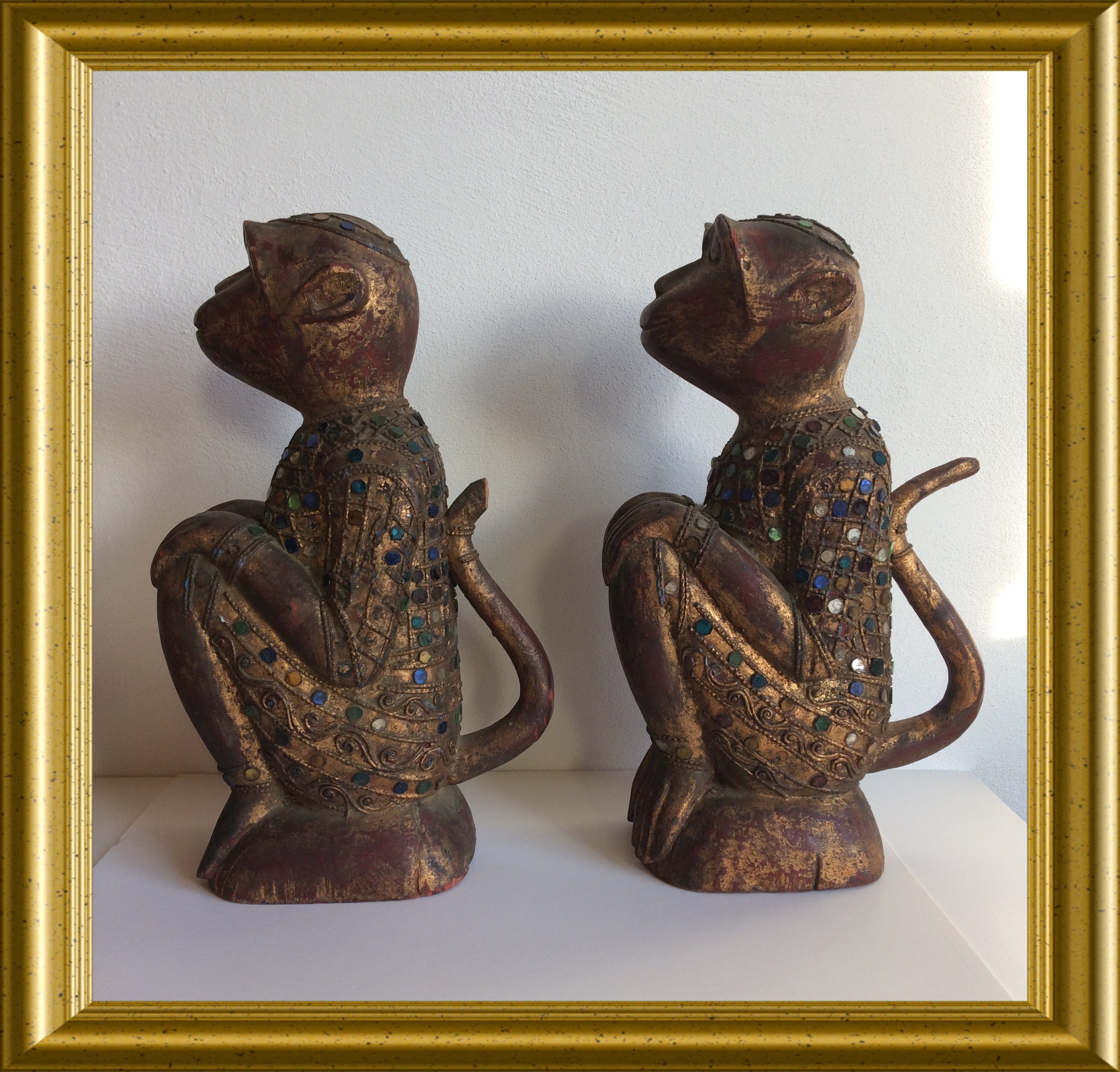 Two vintage wood carved monkeys, decorated with pieces of glass