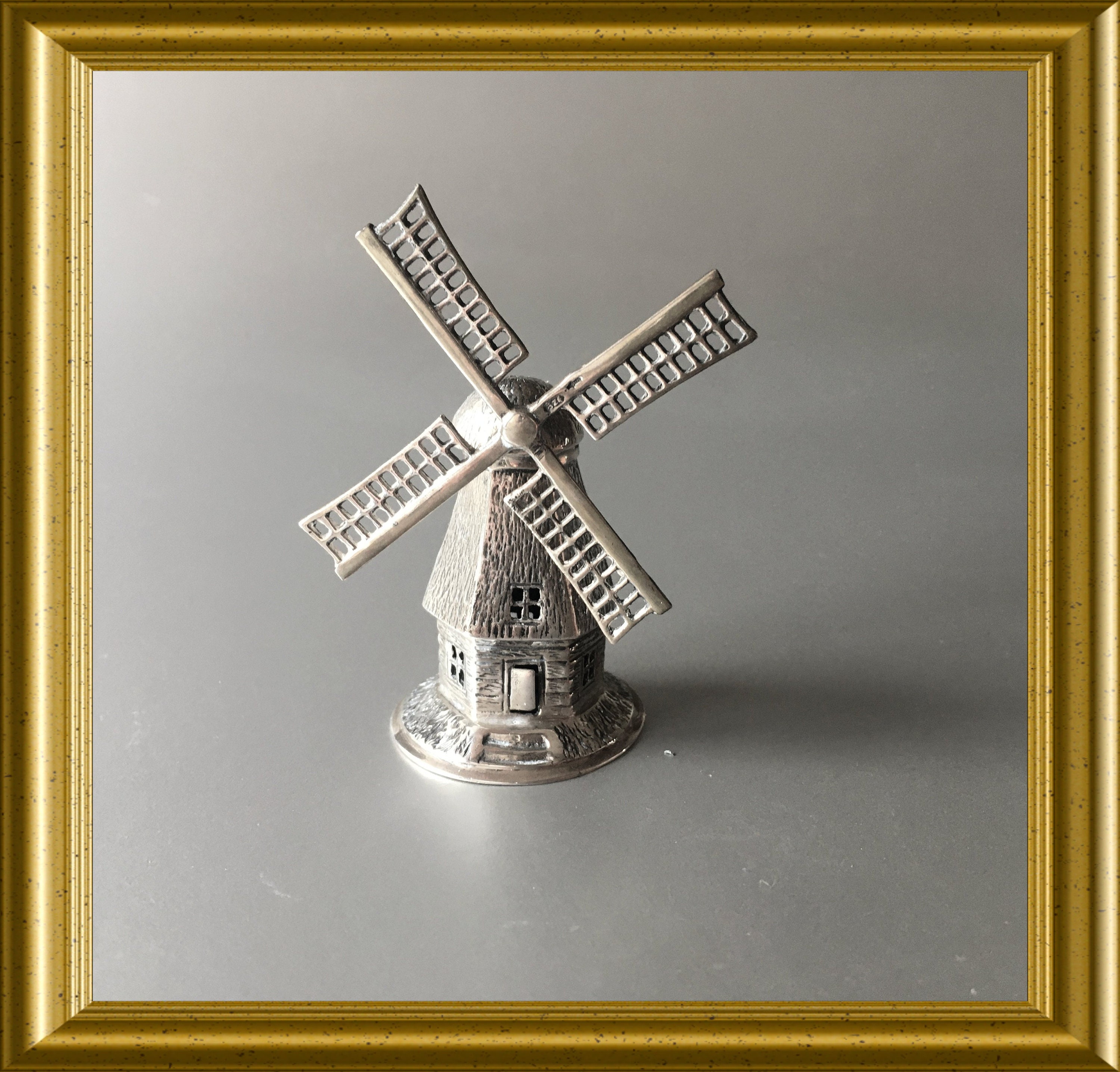 Miniature silver windmill with turnable blades, large model
