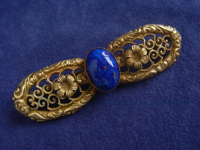 Vintage brooch with blue stone