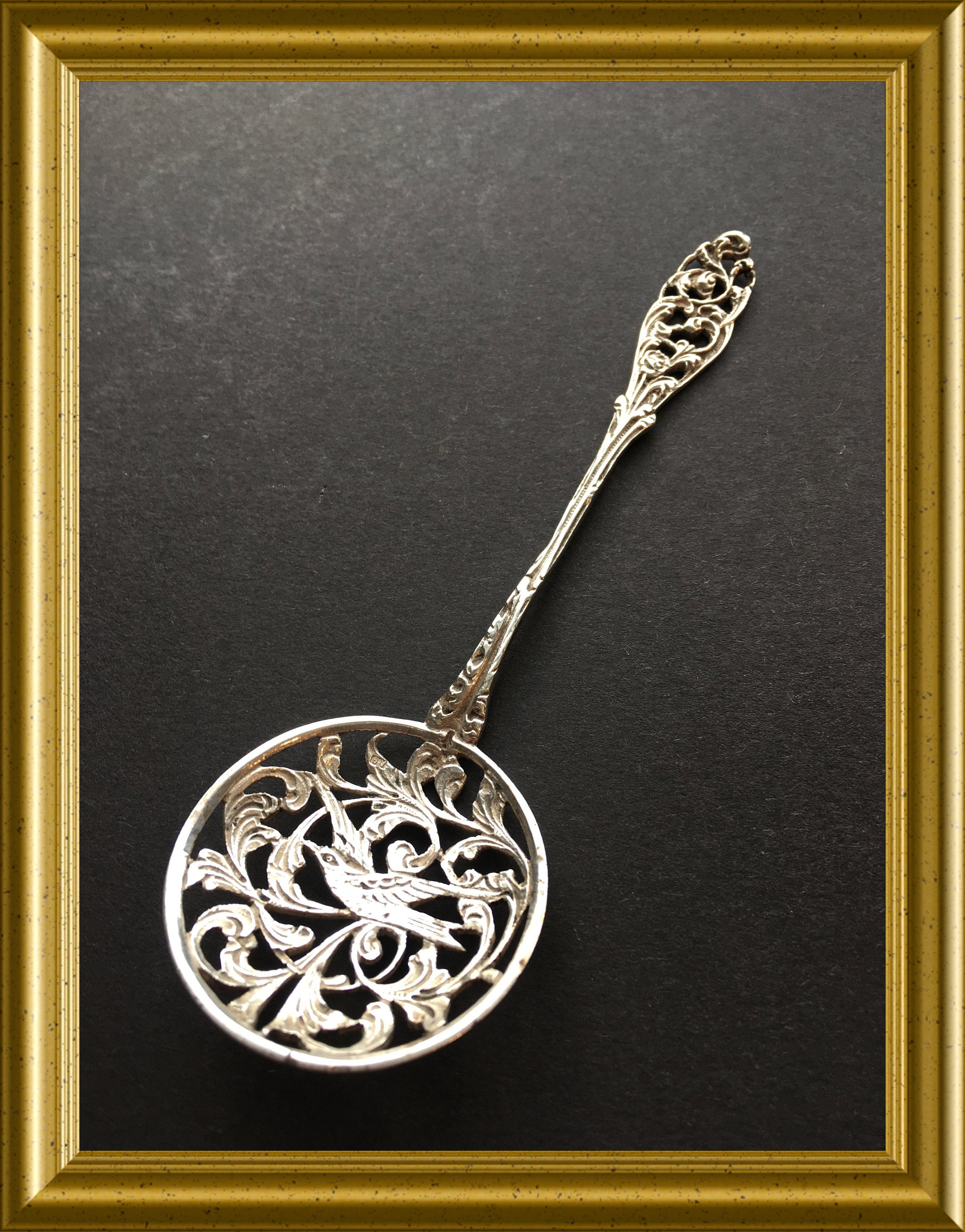 Antique small ornate pierced silver serving spoon: bird