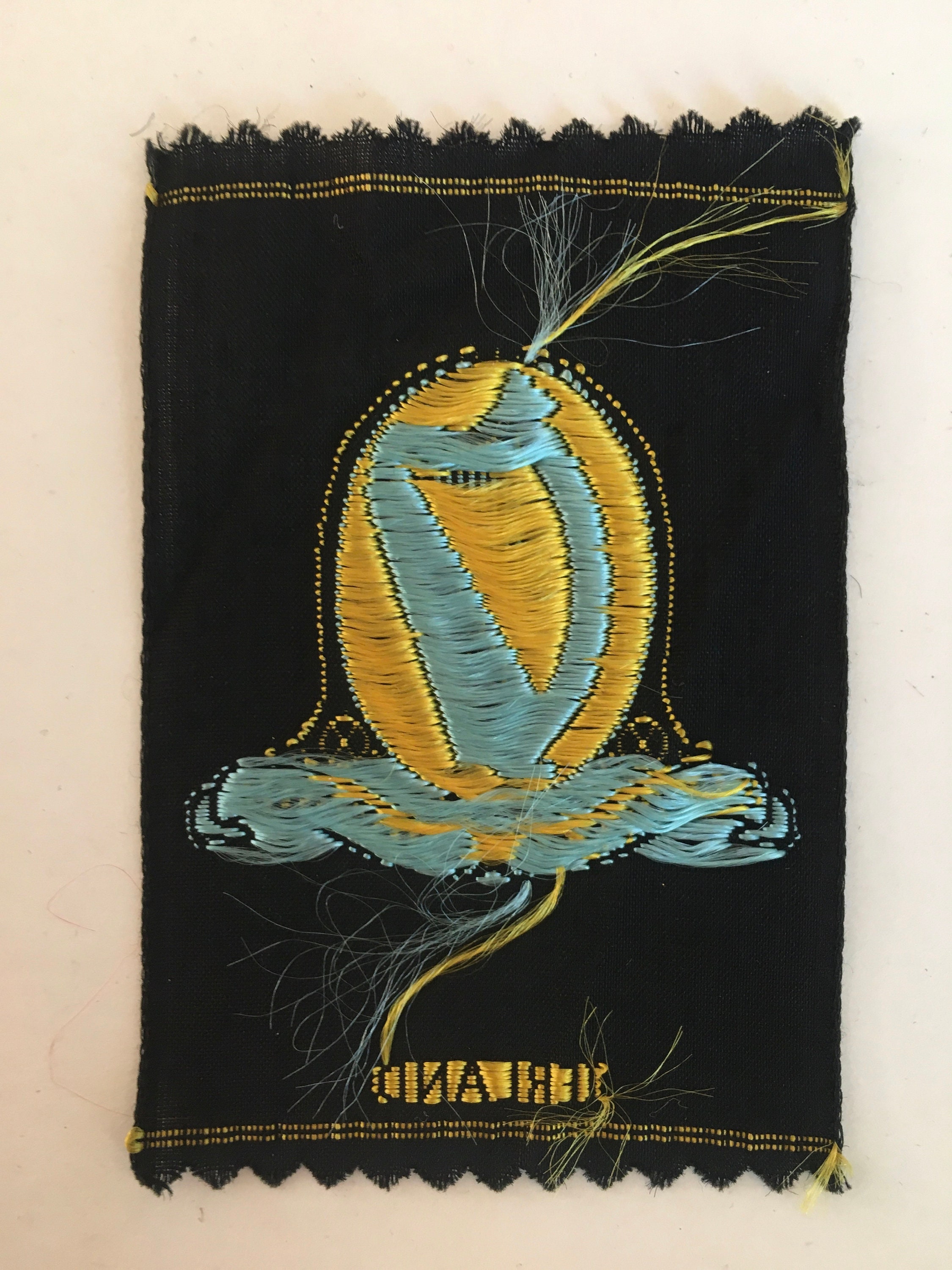 Antique Turmac woven silk tobacco patch: arms Ireland, harp