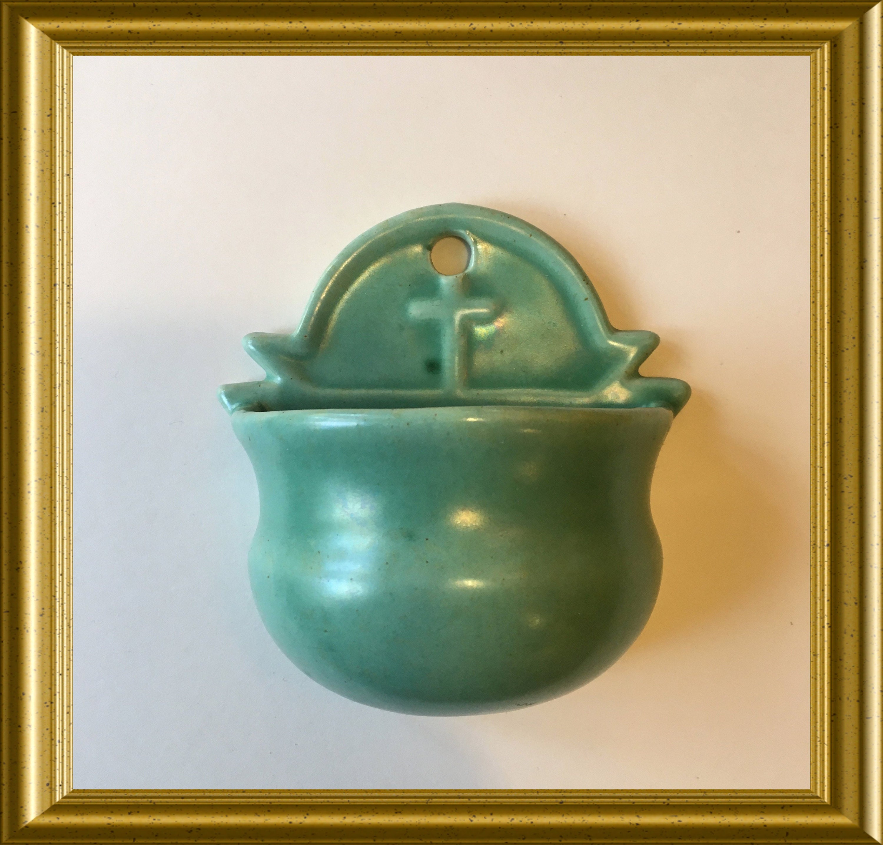 Vintage green ceramic holy water font: cross