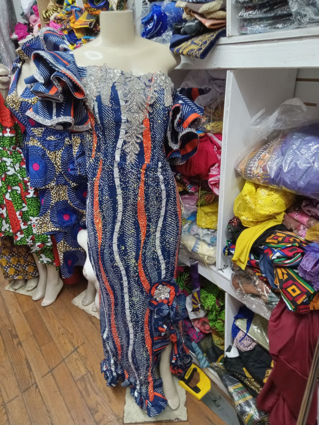 A Long Dress With Train at the Back, Gold Applique in the Chest ...