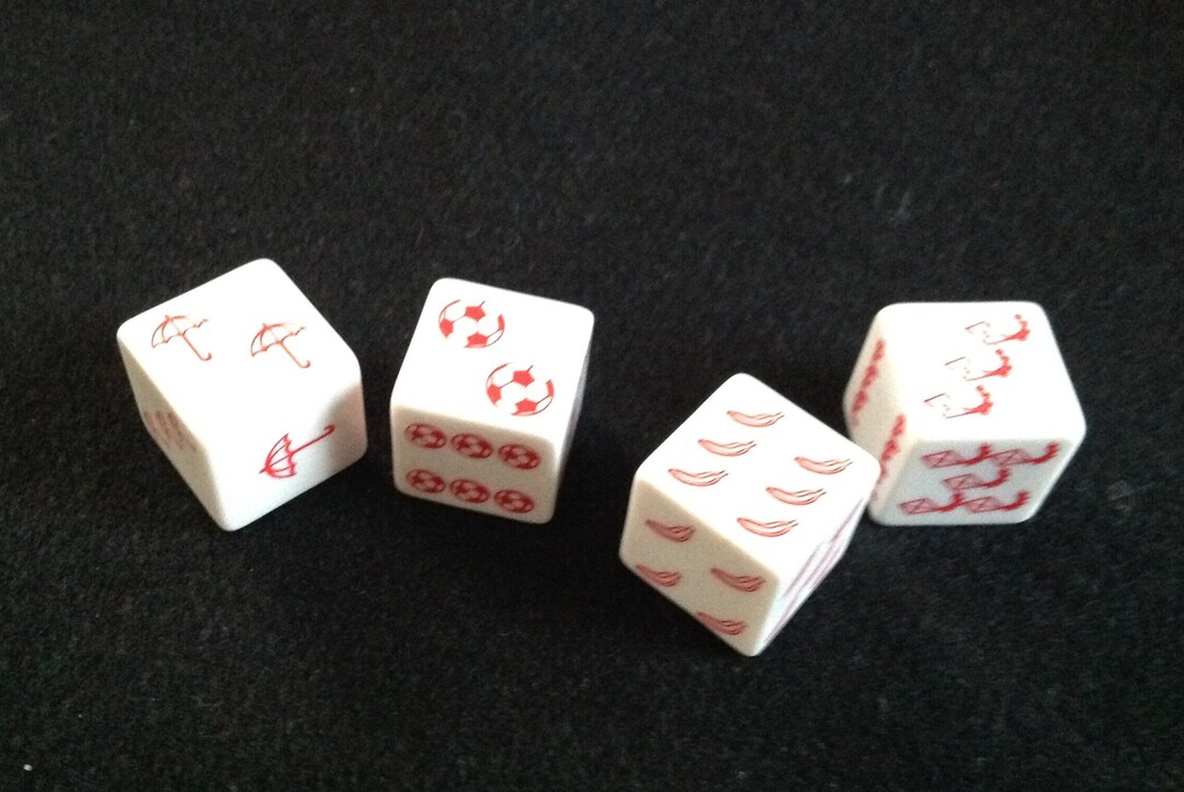 Unusual Set of 4 Dice With Pictures for Spots -- Kites, Soccer Balls ...