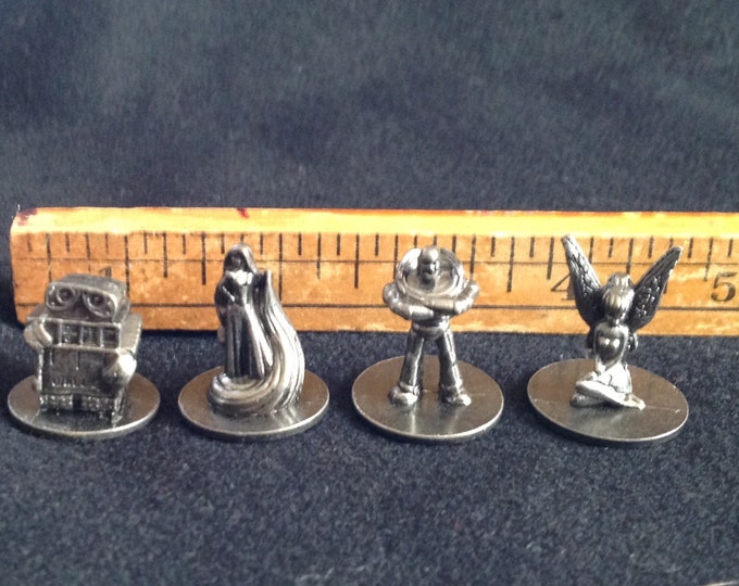 Four Animation-themed Game Tokens From a Disney-themed Scene It Game ...