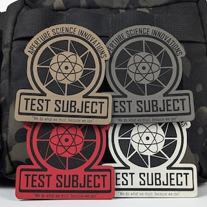 Aperture Science Test Subject Patch We Do What We Must Because We Can ...