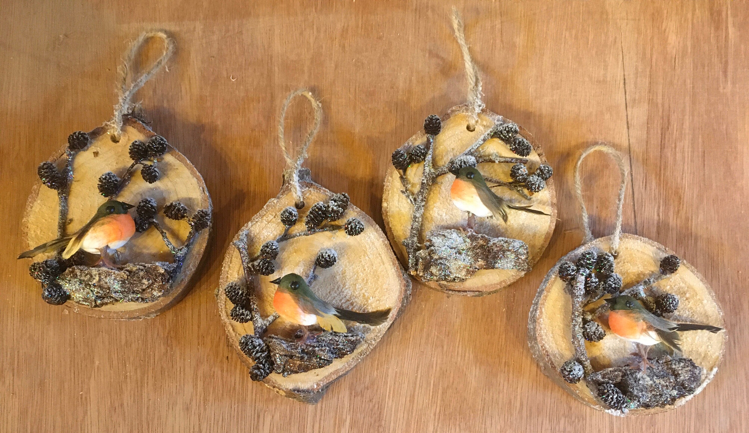 A hanging decoration with a robin on with fake spring flowers | Etsy