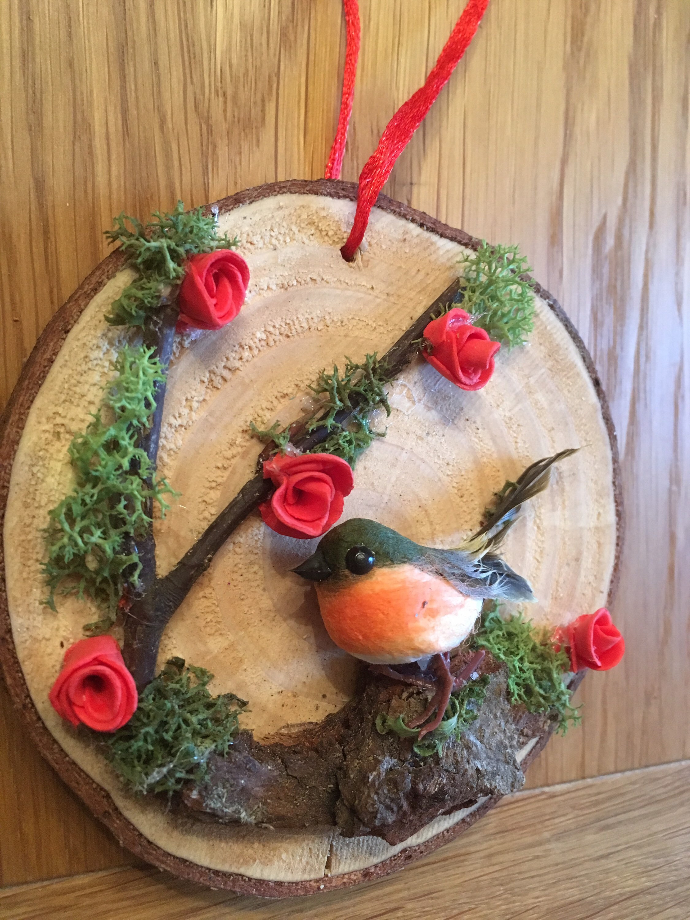 A hanging decoration with a robin on with fake spring flowers | Etsy