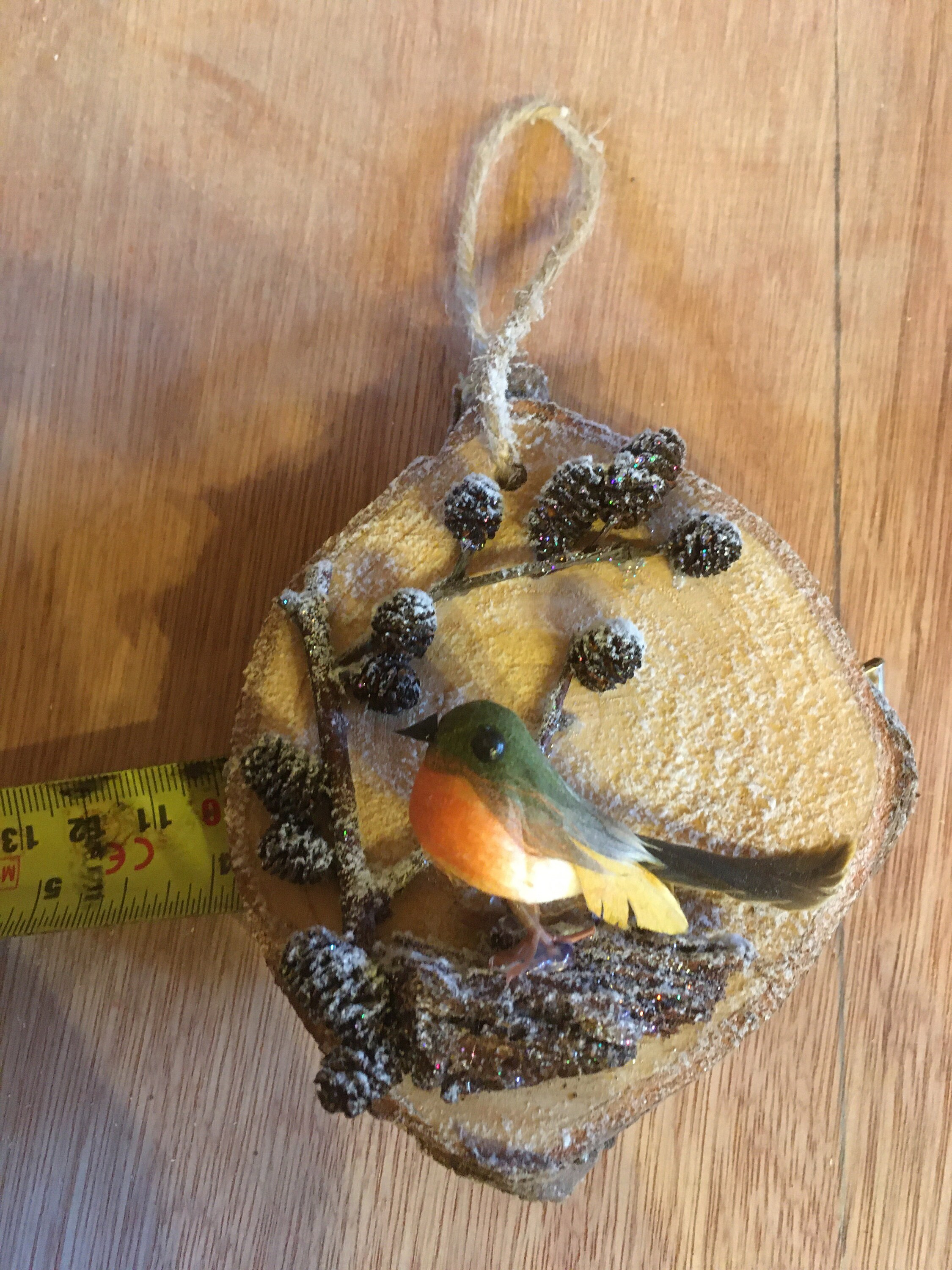 A hanging decoration with a robin on with fake spring flowers | Etsy