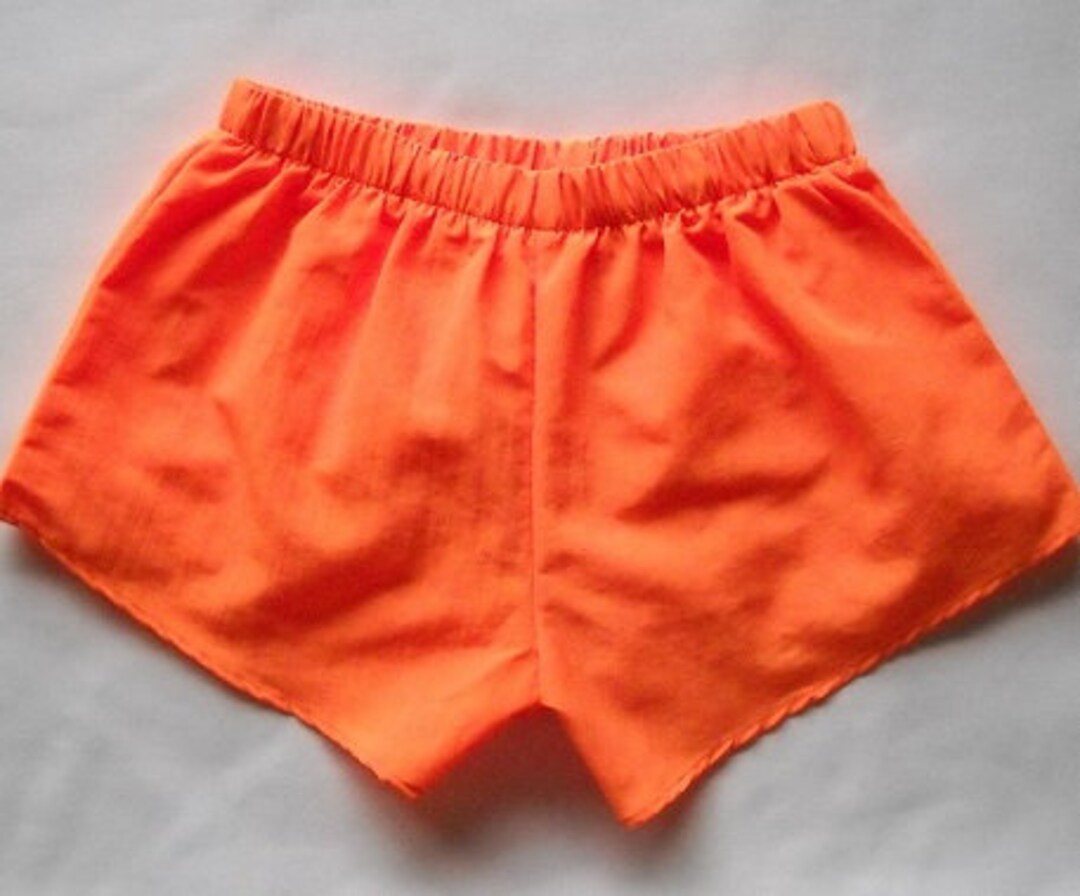 Orange Low Rise Shorts Are Designed to Accent All Figures. Stately ...