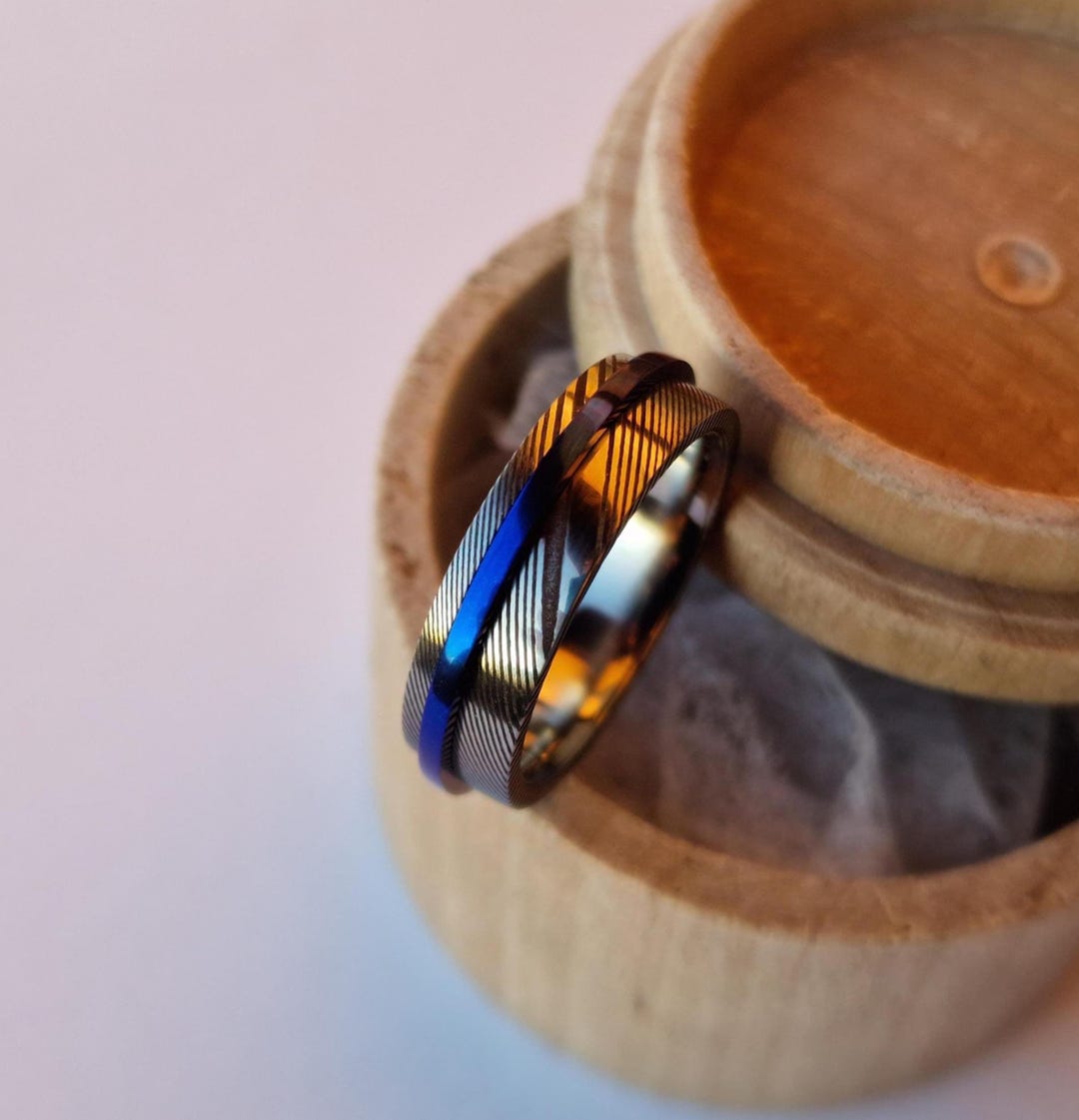 Stainless Damascus Steel and Anodized Titanium Spinner Ring. Handmade ...