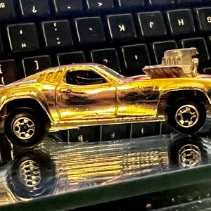 Hot Wheels Rodger Dodger Chrome Gold Plum Purple Charger. Black Wall ...