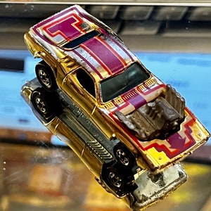 Hot Wheels Rodger Dodger Chrome Gold Plum Purple Charger. Black Wall ...
