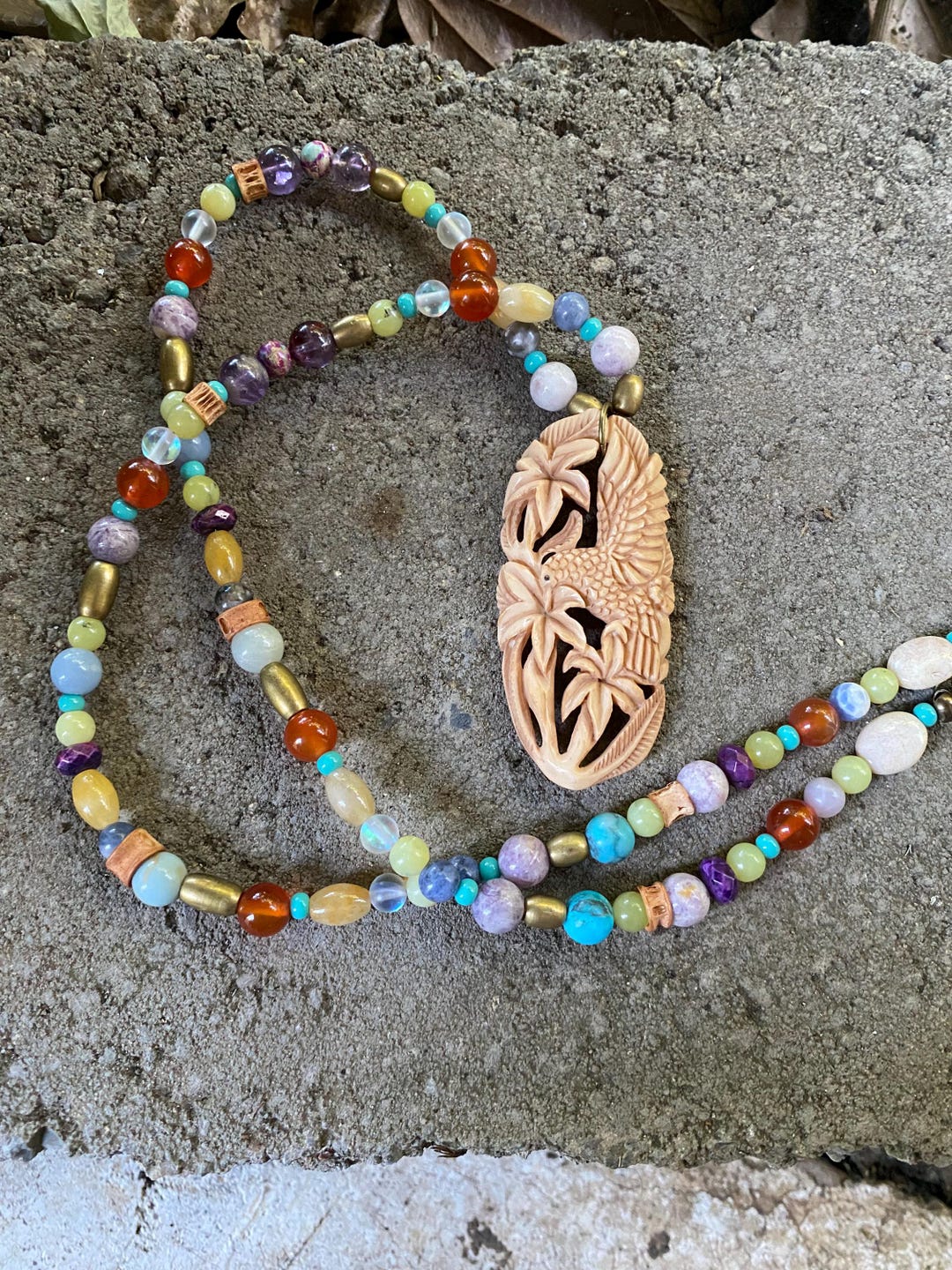 Hummingbird Pendant Carved of Bone Hung From a Long Strand of Mixed ...
