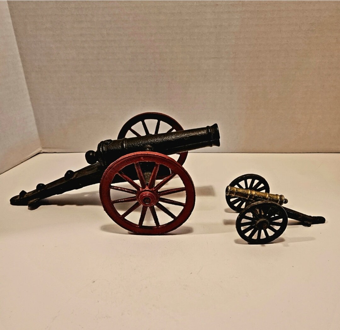 2 Vintage Cast Iron Desktop Cannons One With Red Wheels and A Mini ...
