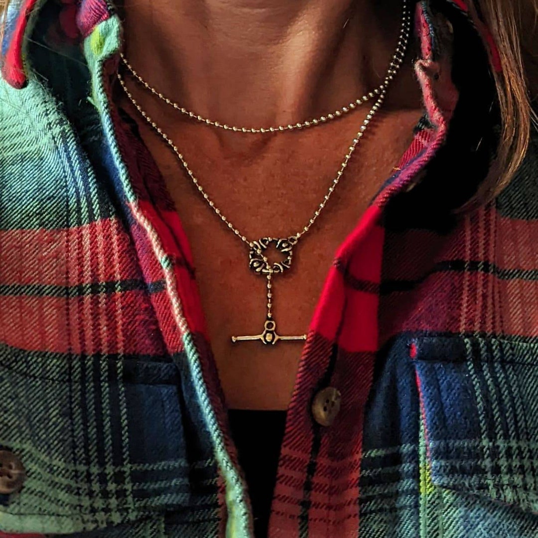 A Gorgeous Silver Ball Chain Wrap Necklace With a Detailed Ring and Bar ...
