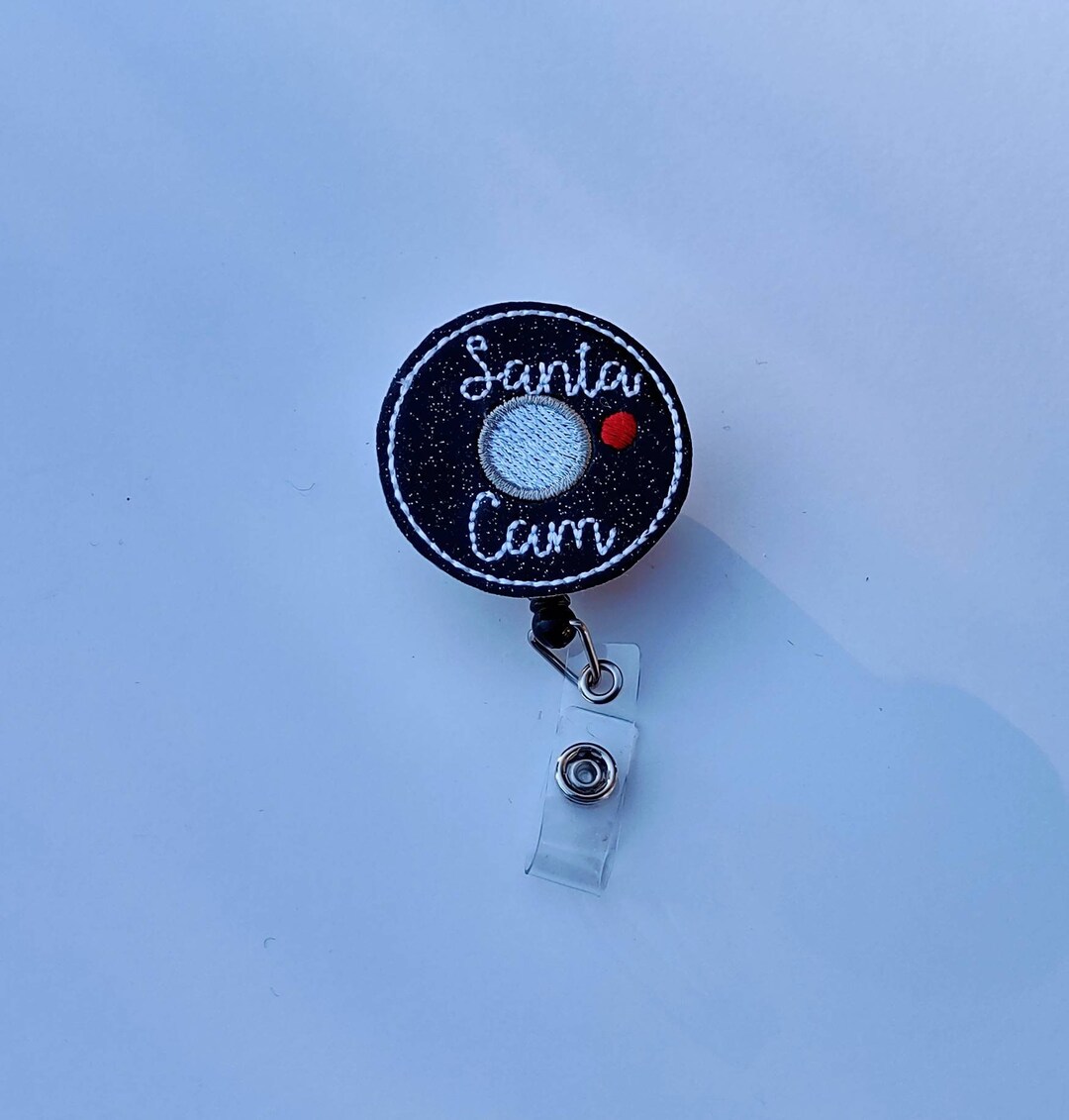 Santa Cam Glitter Vinyl Badge Reel - Etsy