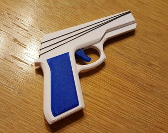 Magazine fed rubber band gun plans