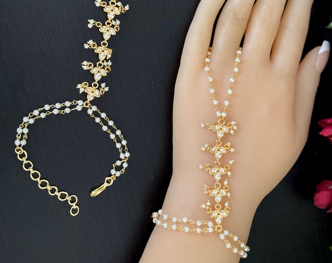 A Pair of Gold Finished Pearl Bracelet/ Haathphool /hath Panja Ring ...