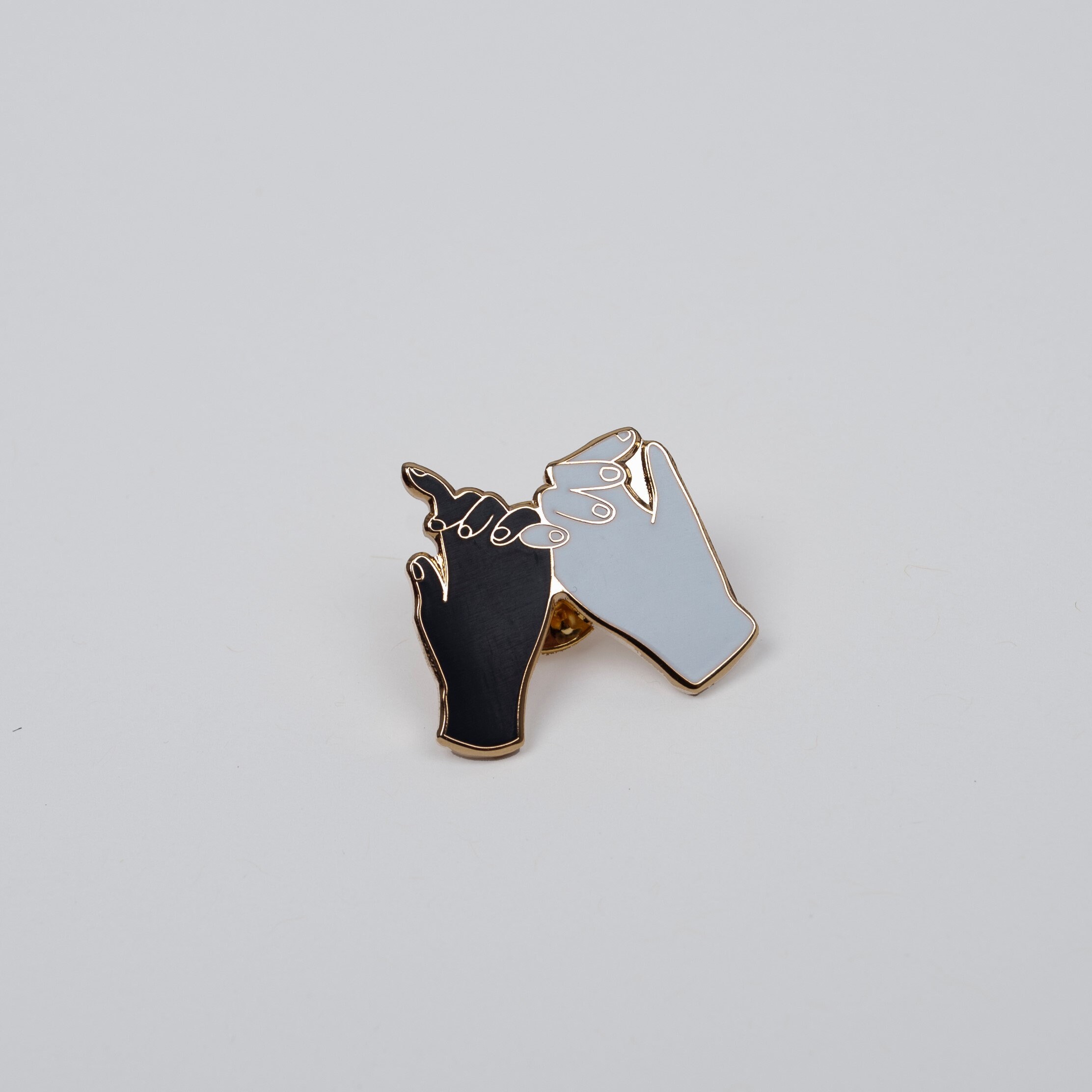 Enamel Pins - Black and White Hand Holding Embracing Hands Enamel Pin ...