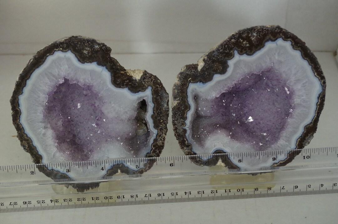 A Polished Matching Geode Pair Filled With Light Amethyst Crystals ...