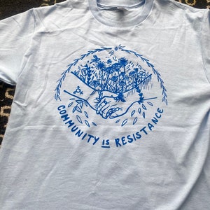 Community is Resistance T Shirt - Etsy