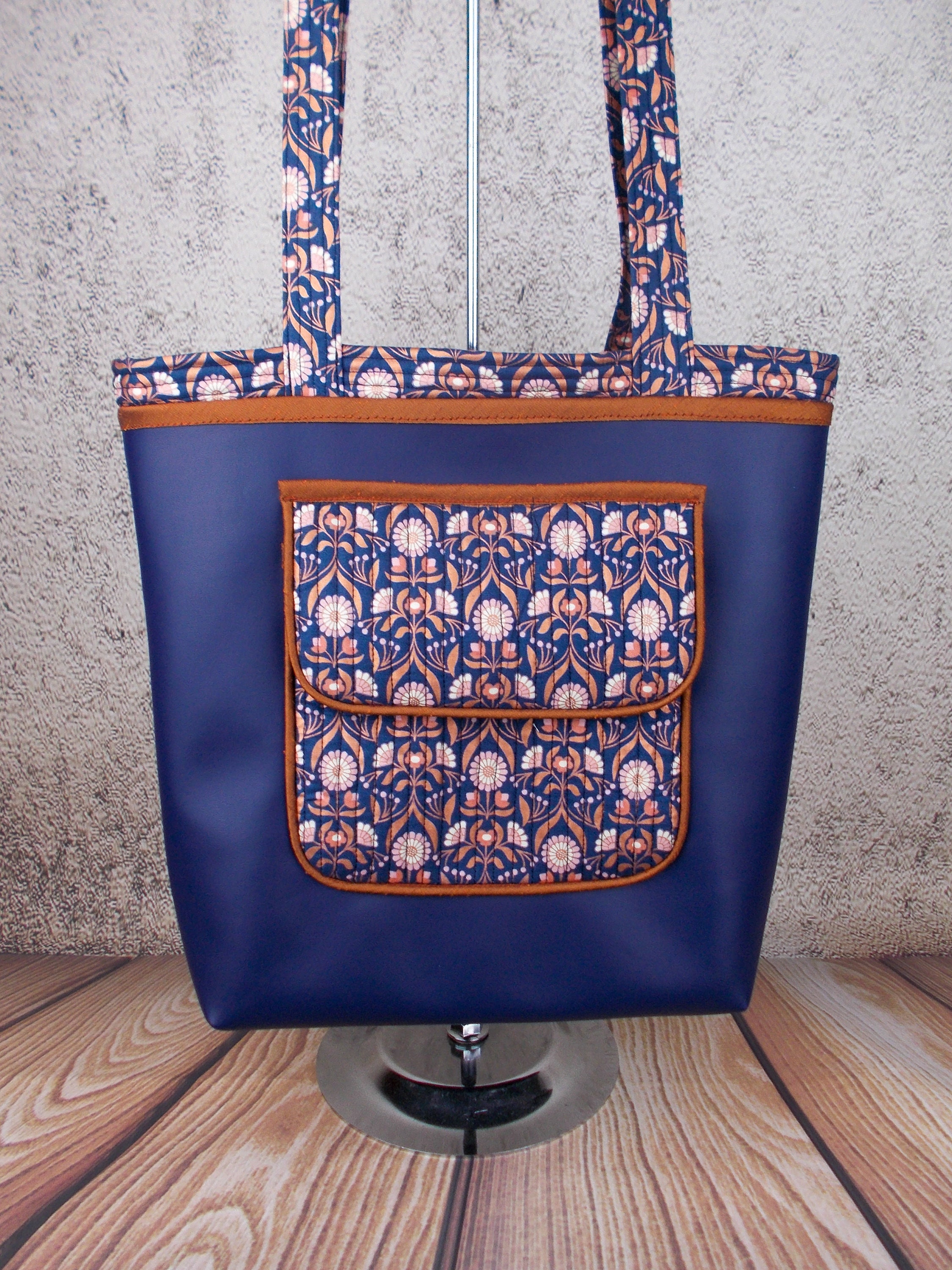 Tote Bag in Navy Faux Leather With Contrasting Print Pocket and Bronze ...