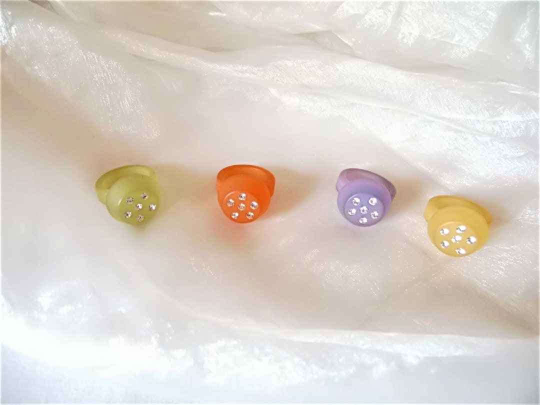 Small Round Pastel Colored Plastic Rings With Glitter Stones From the ...
