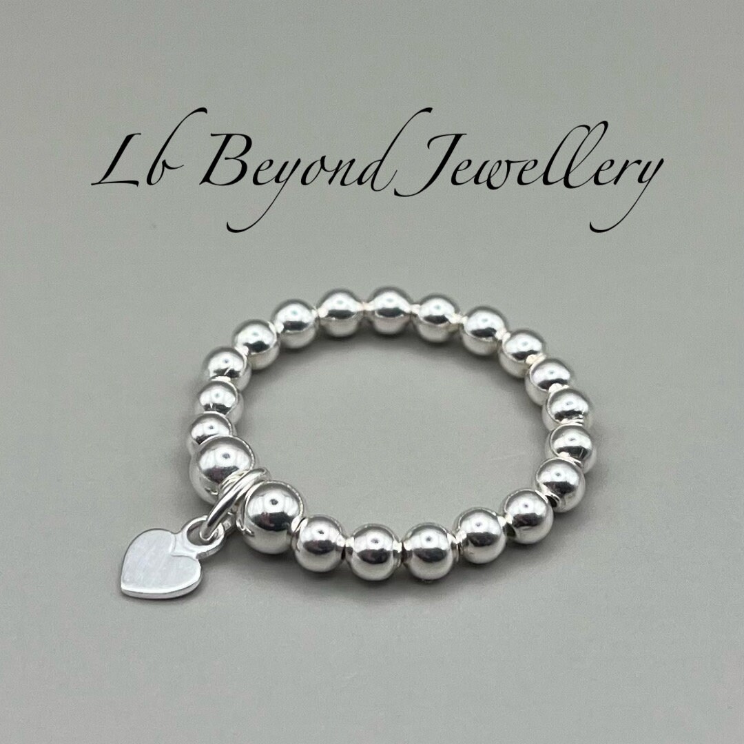 Sterling Silver Beaded Stretch Stacking Ring With Mini Heart Charm ...
