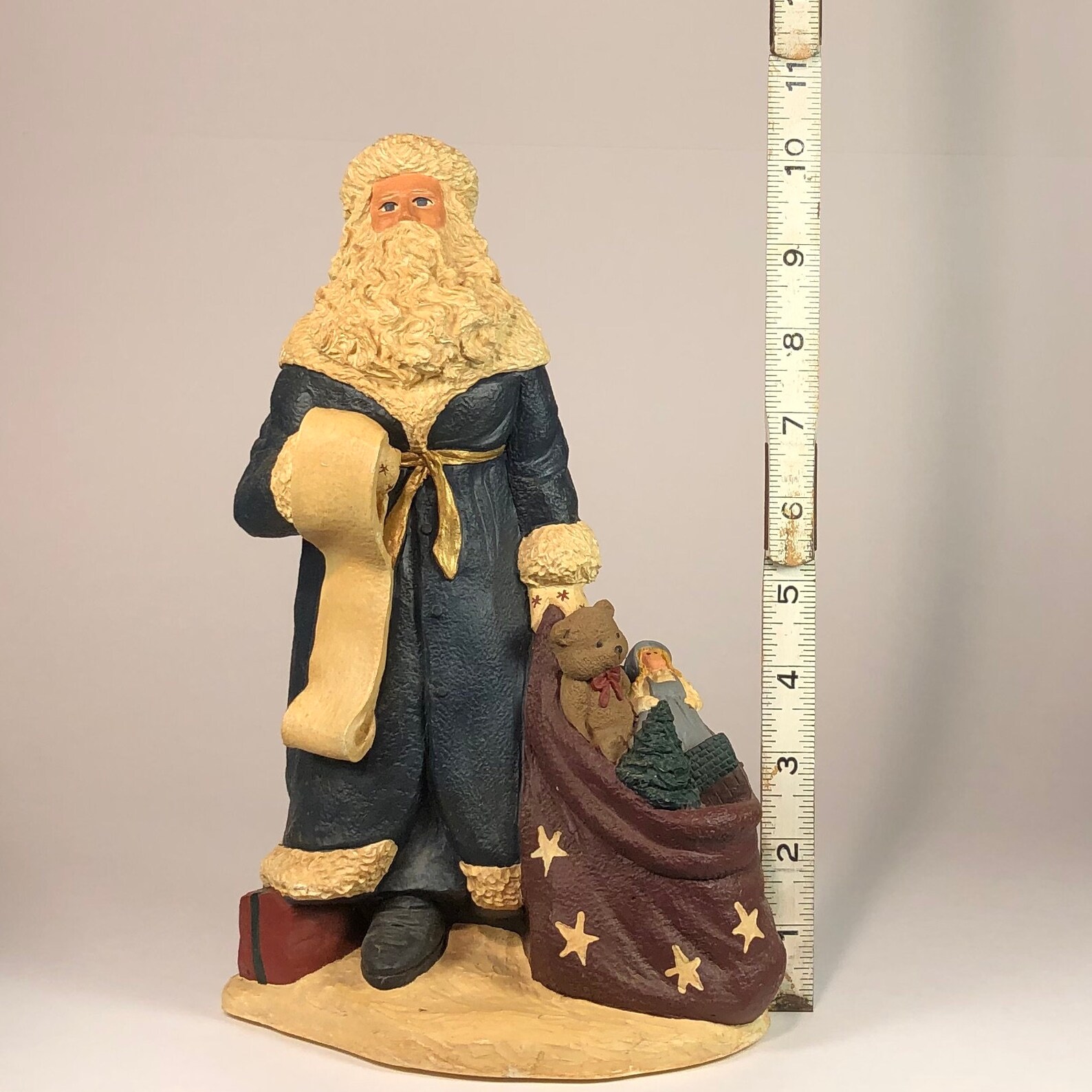 Hand Painted Resin Santa Claus in Blue With List and Sack of Presents ...