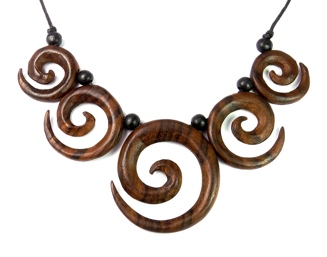 Wooden Jewelry Wooden Chain Spirals in Staggered Sizes on a Black ...