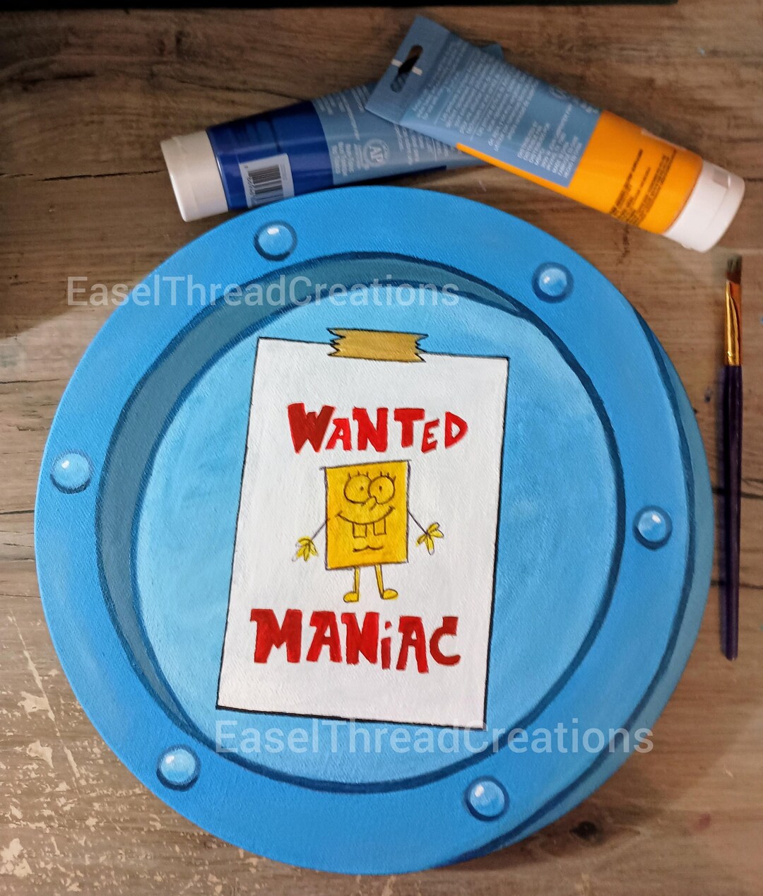 Porthole Window Round Canvas Artwork; Wanted Maniac Bob Silly Painting ...