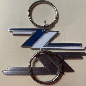 SET of 2 ZZ TOP White and Deep Blue and A Plain Silver Key Chain Solid ...