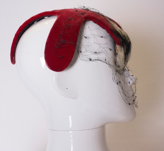A Vintage 1950s Red Velvet , Feather and Net Hat - Gem