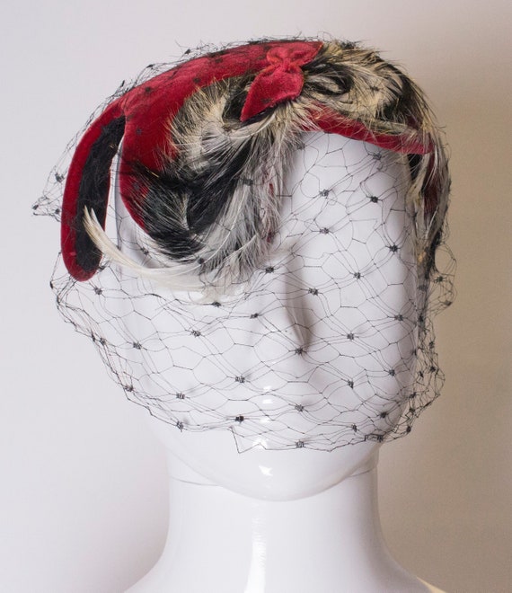 A Vintage 1950s Red Velvet , Feather and Net Hat - Gem