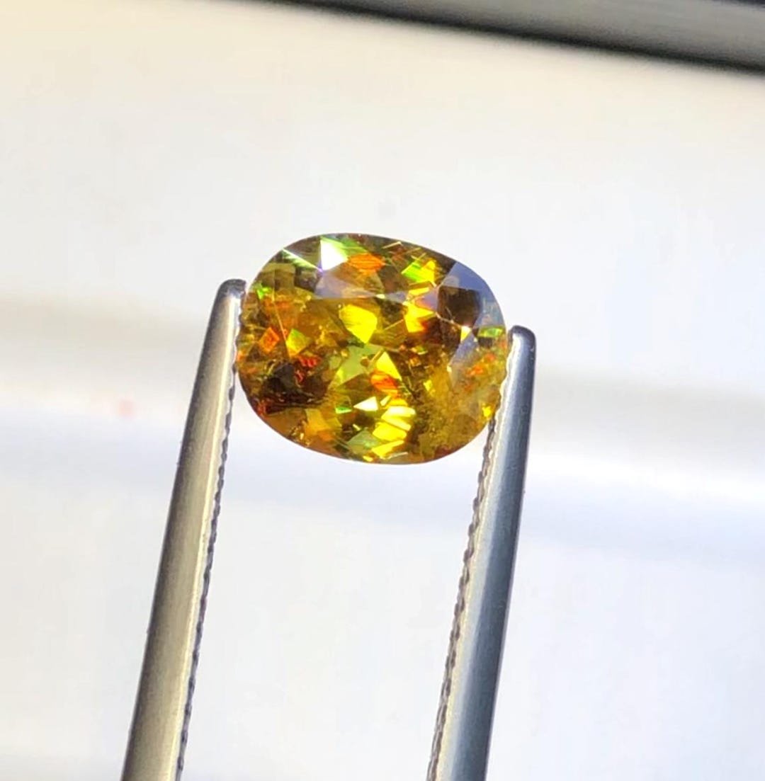 Oval Cut Sphene Gemstone: 2.00 CT Yellow Titanite With Red & Green Fire ...