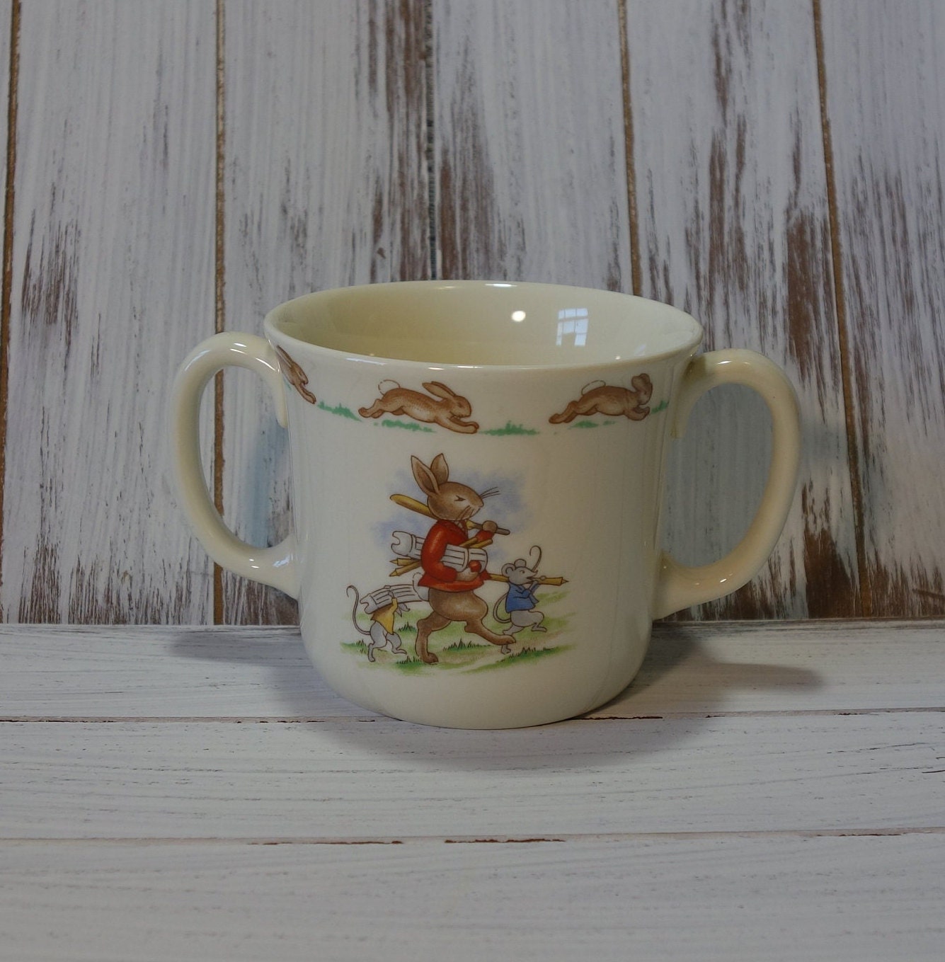 Royal Doulton Bunnykins Hug-a-mug Two-handled Baby Cup Rabbits Playing Wheelbarrow Game Cricket ...