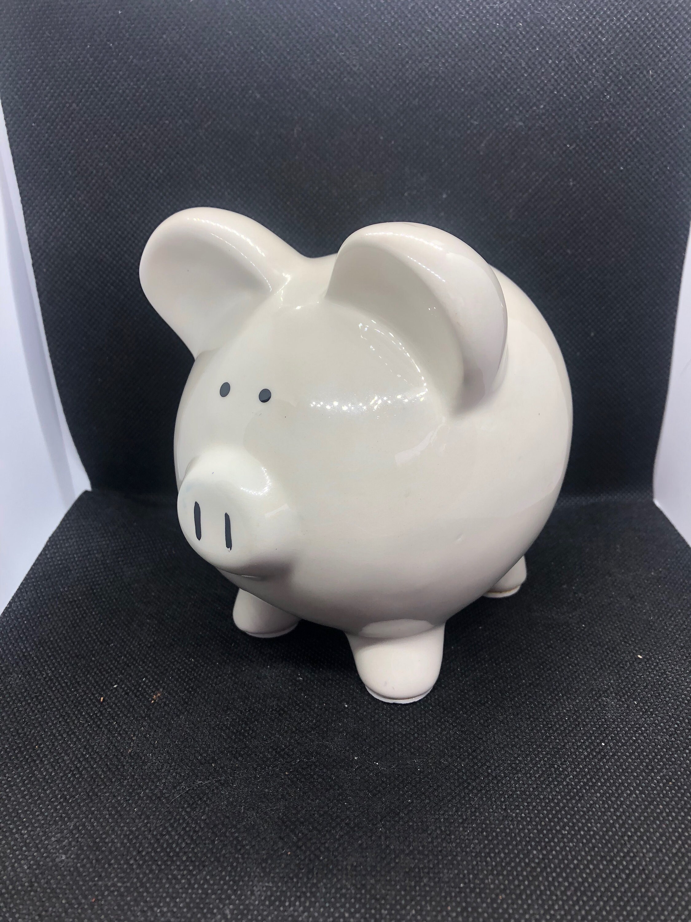 Cute ceramic piggy bank in shape of pig can be coloured with washable markers