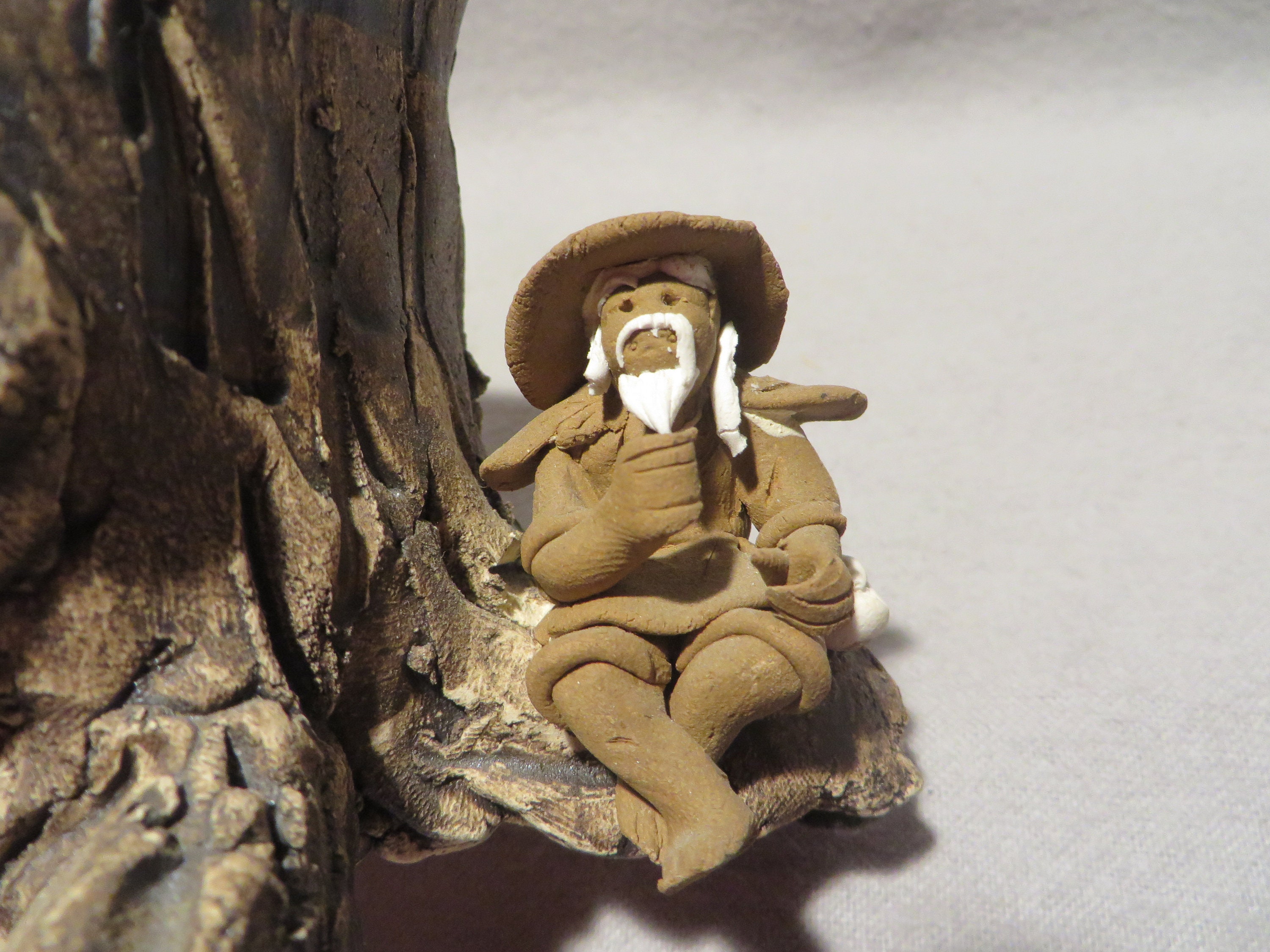 Vintage Oriental Miniature Mud Man Figurine Sitting on a Tree Stump ...