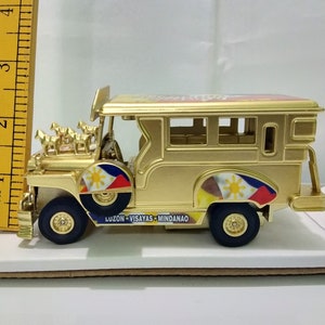 Yellow Medium Size Jeepney Die-cast Metal Toy and Small Barrel Man ...