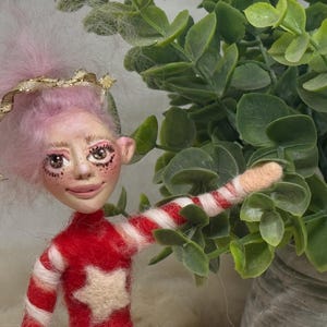 Santa’s Little Elf, in Red and White and a White Star on Her Chest ...