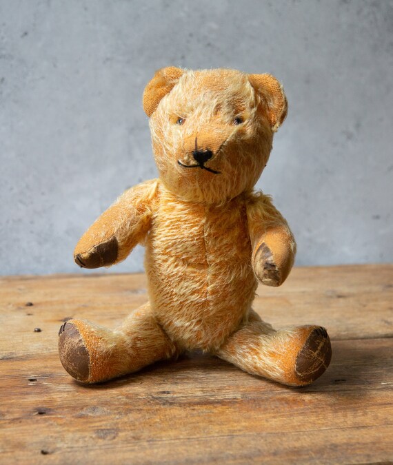 Teddy bear with stitched eyes store
