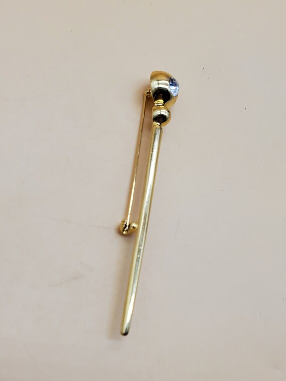 vintage gold tone long staff scepter brooch with clea… - Gem